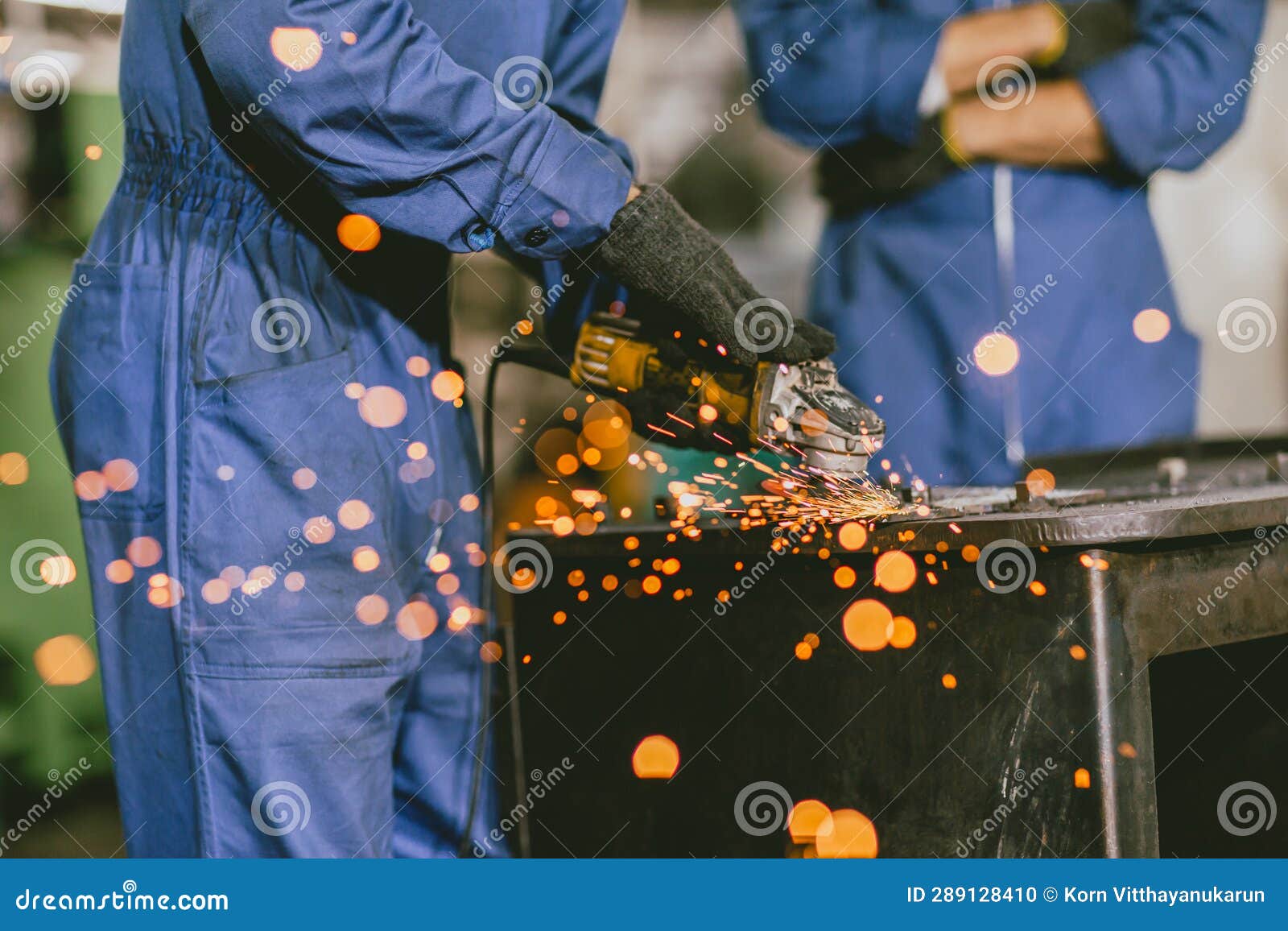 Industrial Worker Using Angle Grinder and Cutting a Metal Sheet ...
