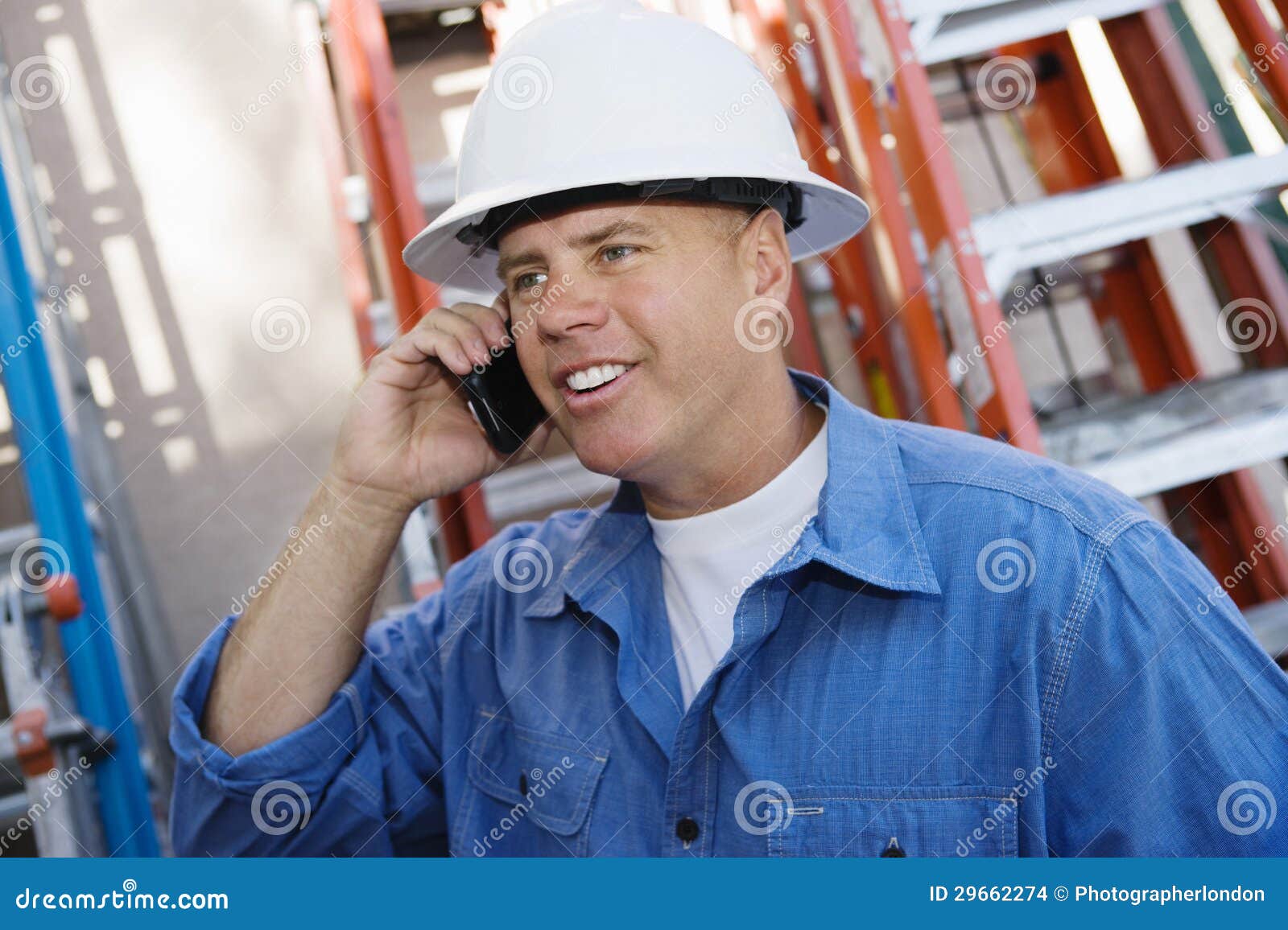 Industrial Worker Using Cell Phone Stock Photo - Image of blue ...