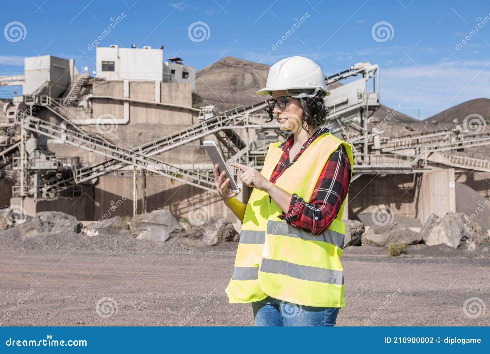 Industrial Worker Using Tablet on Construction Site Stock Photo - Image ...