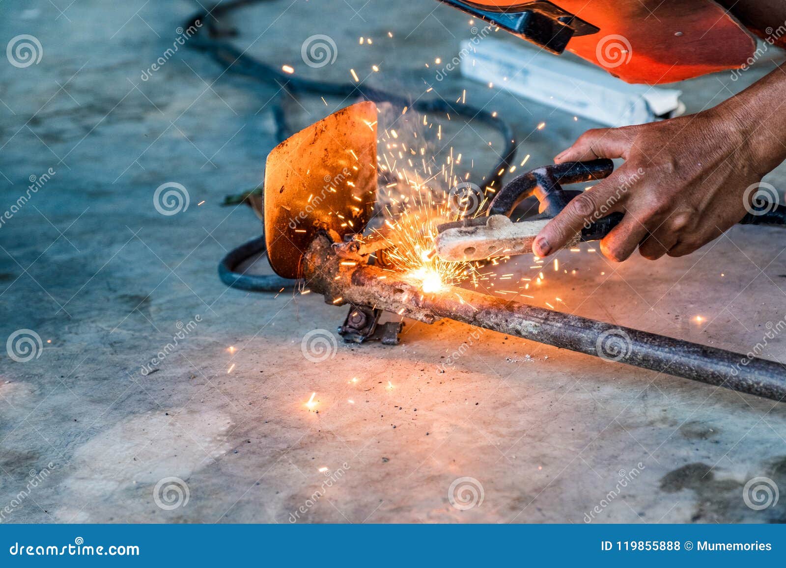 Industrial Worker Using Welder Machine is Welding a Spade Tool Stock ...