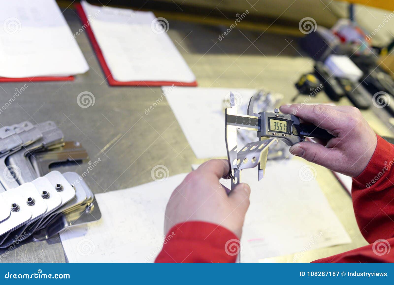 Industrial Workers Inspect Work Piece for Accuracy with Measuring ...