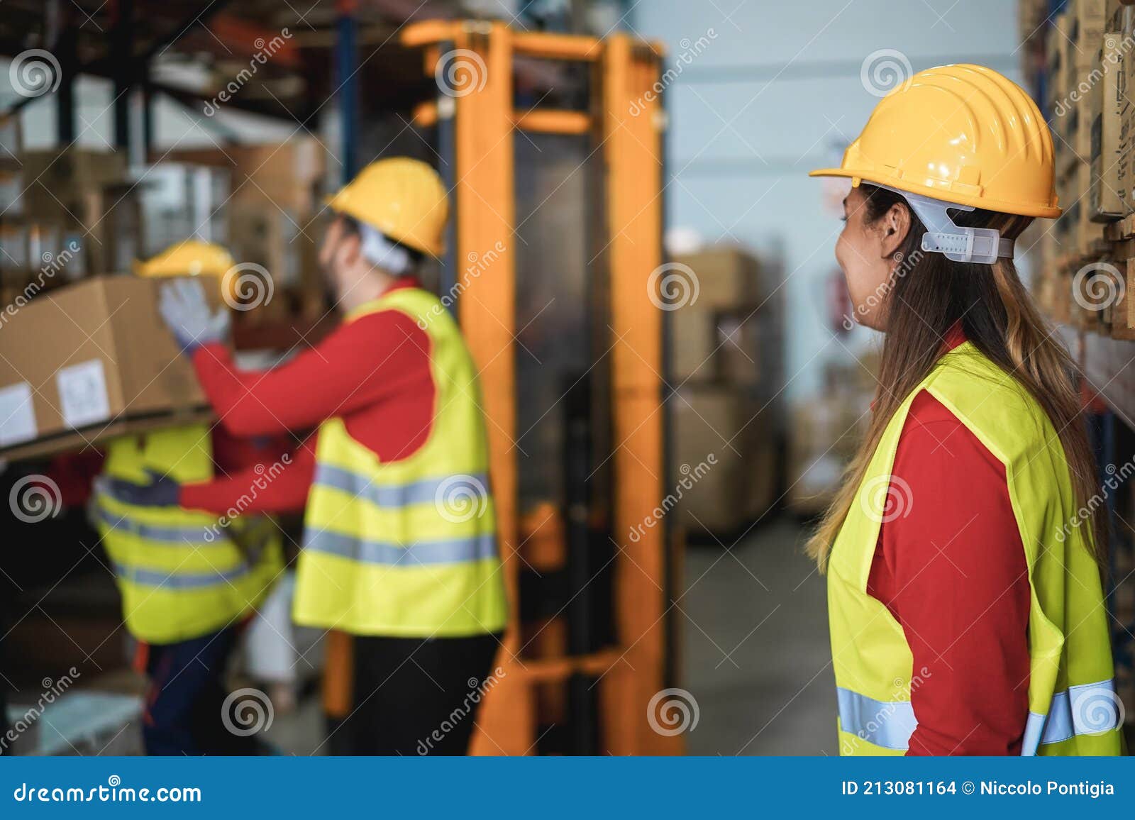 Industrial Workers Loading Delivery Boxes Inside Warehouse Store ...