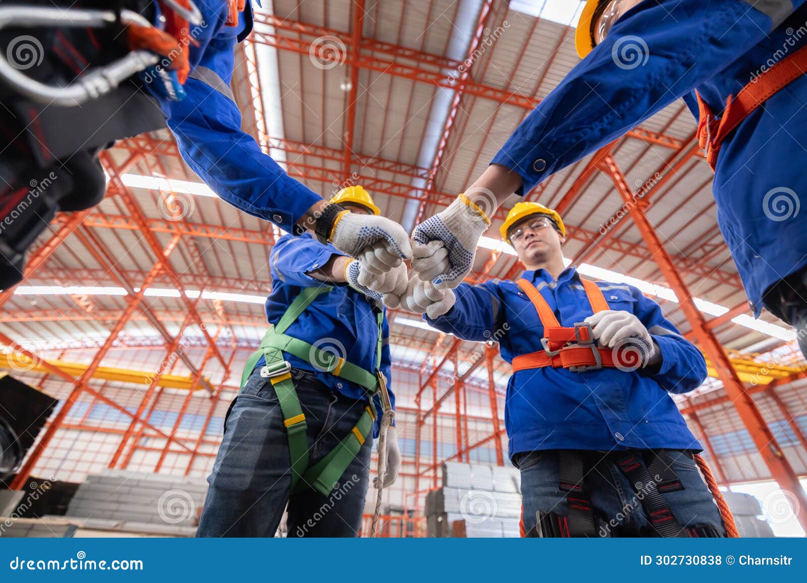 Industrial Workers Standing with Fist Bump Gesture Showing Their ...