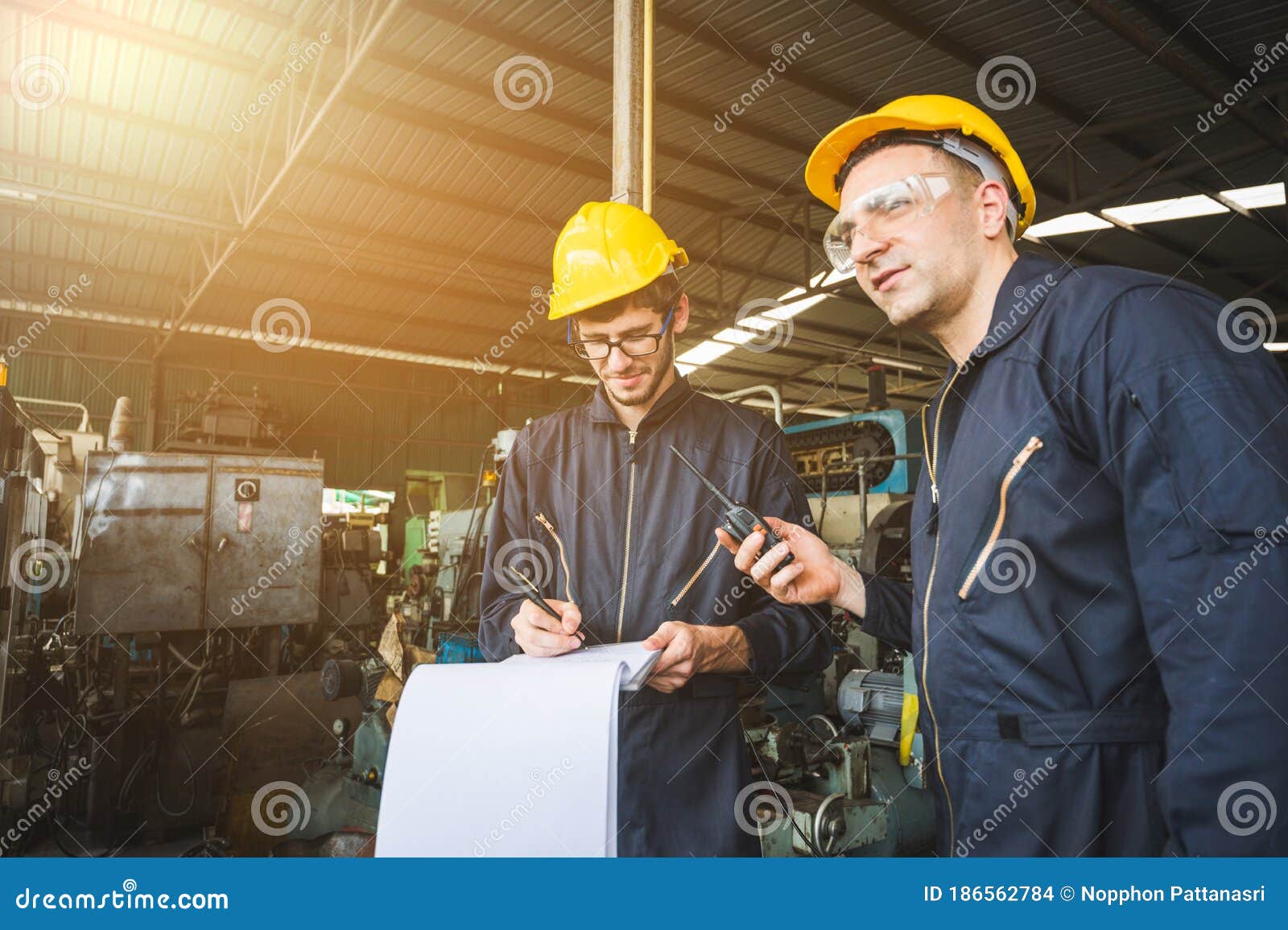 Industrial Workers are Working on Projects in Large Industrial Plants ...