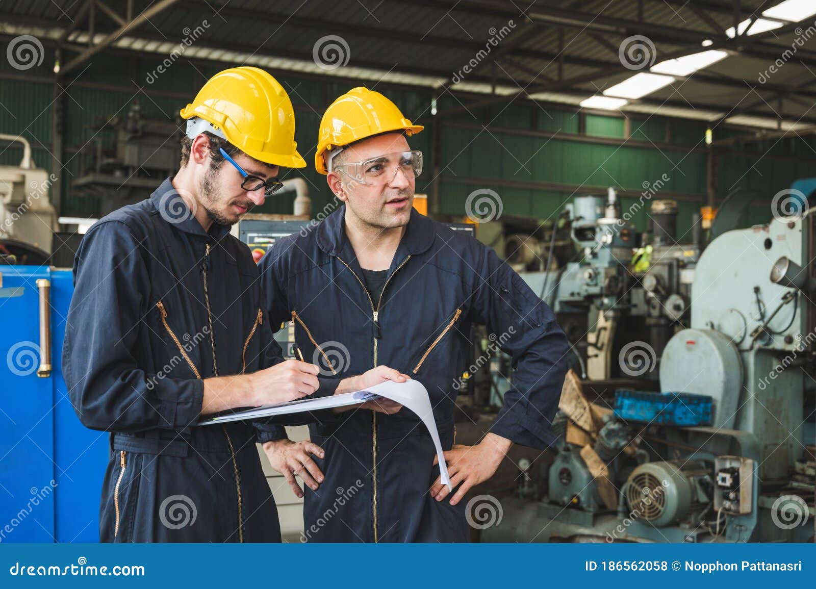 Industrial Workers are Working on Projects in Large Industrial Plants ...