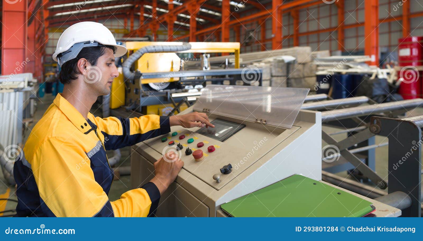 Industrious Worker Meticulously Operating Complex Machinery within a ...