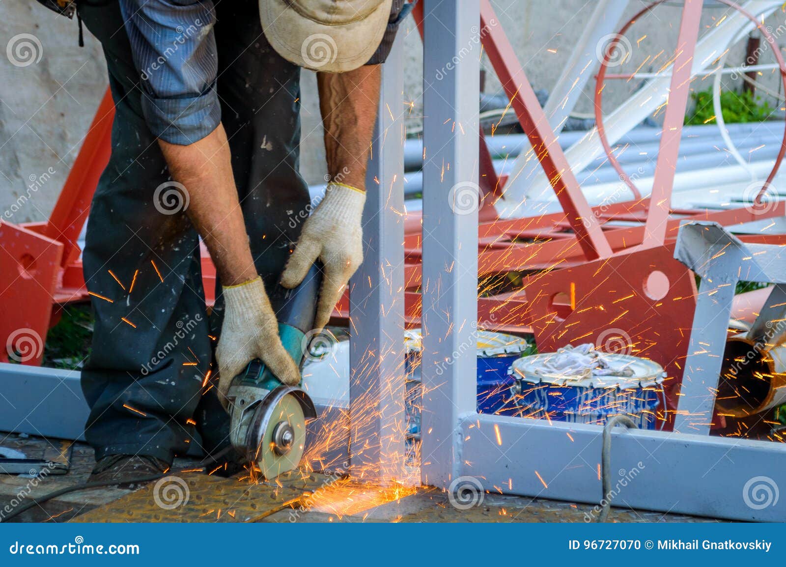 A Industry Construction Worker Using an Angle Grinder for Cut of Metall ...