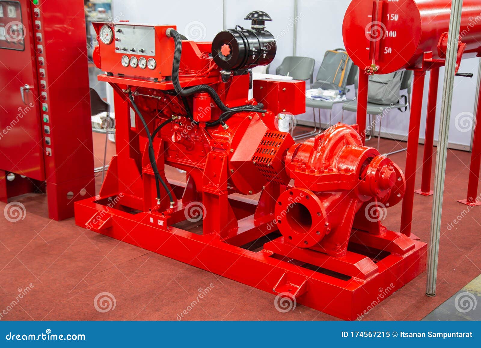 Red Fire Pump In Front Of Concrete Wall. Fire Safety Pump On Cement ...