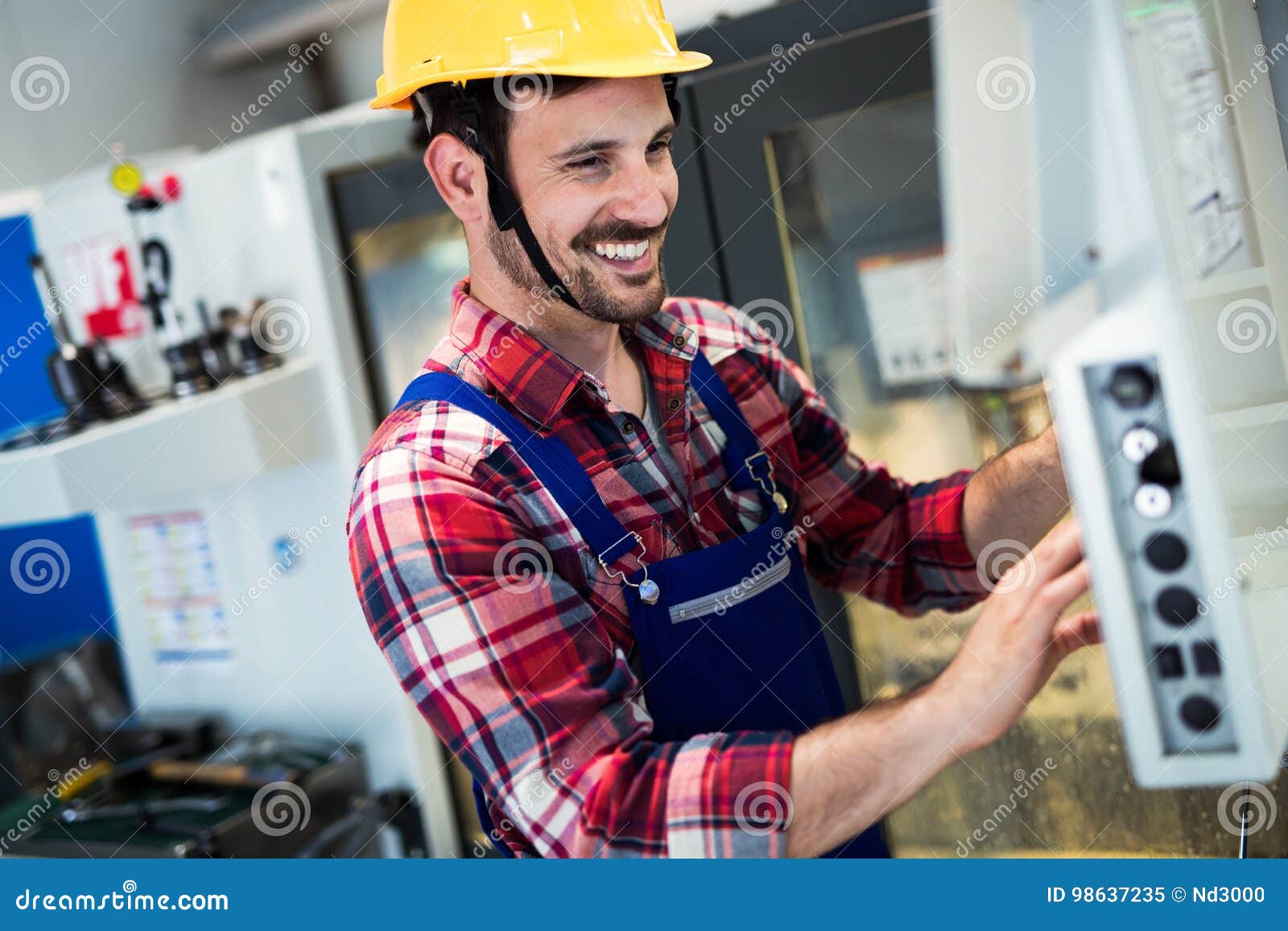 Industry Worker Entering Data in CNC Machine at Factory Stock Image ...