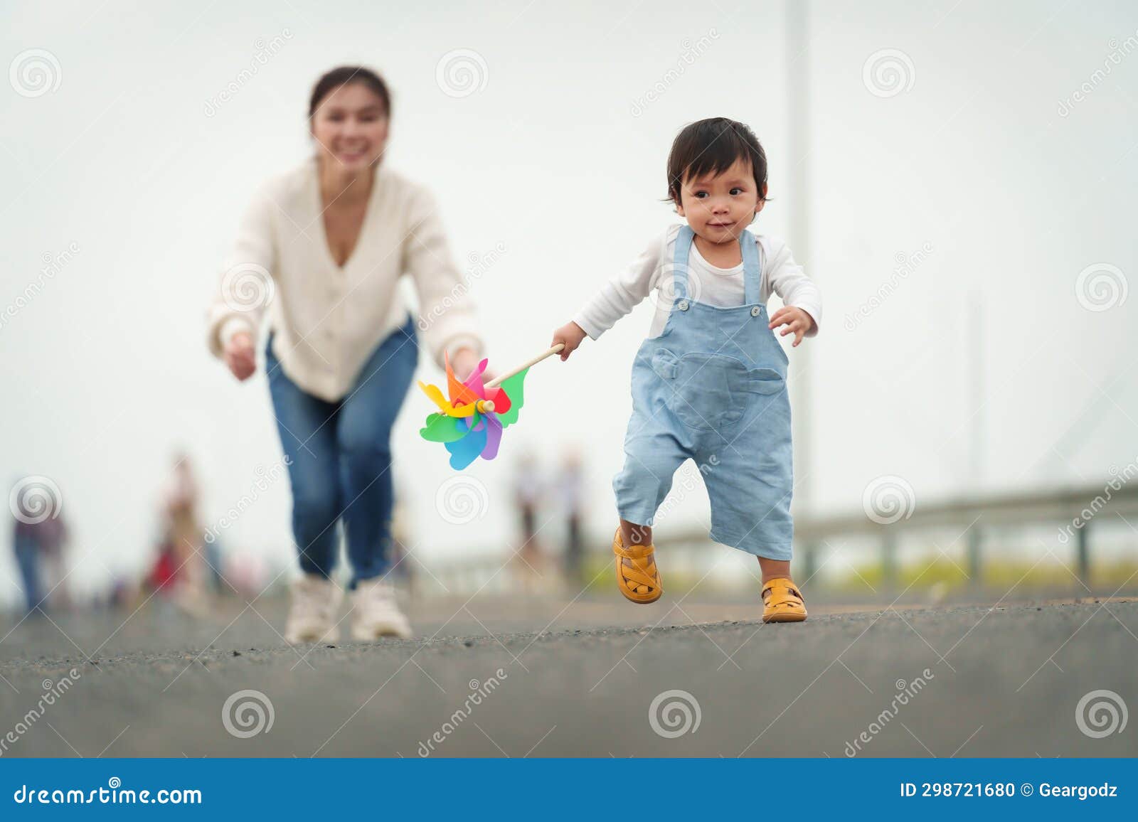 Infant Baby Learn Walking First Step on Pathway with Mother Helping ...