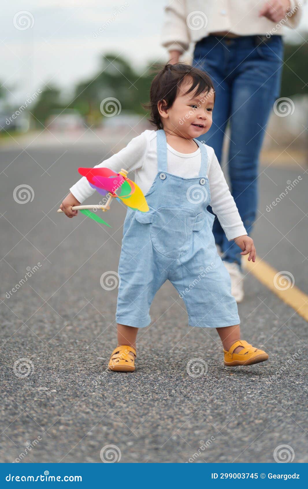 Infant Baby Learn Walking First Step on Pathway with Mother Helping ...