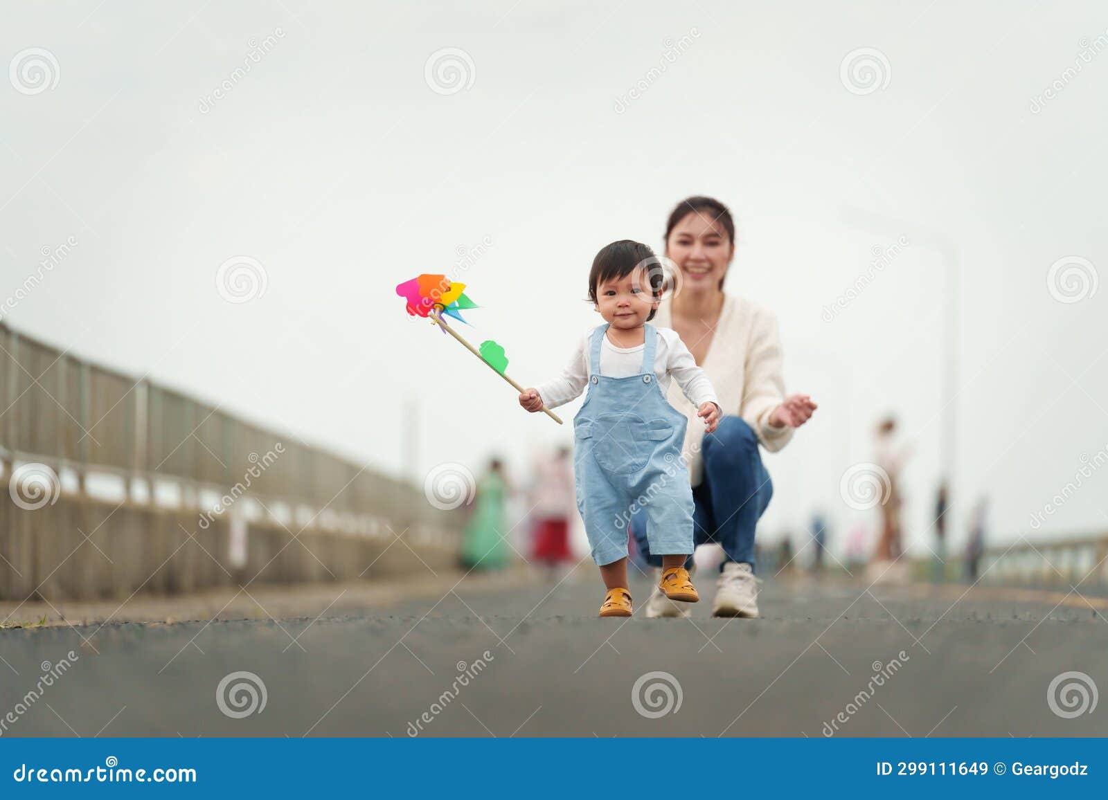 Infant Baby Learn Walking First Step on Pathway with Mother Helping ...