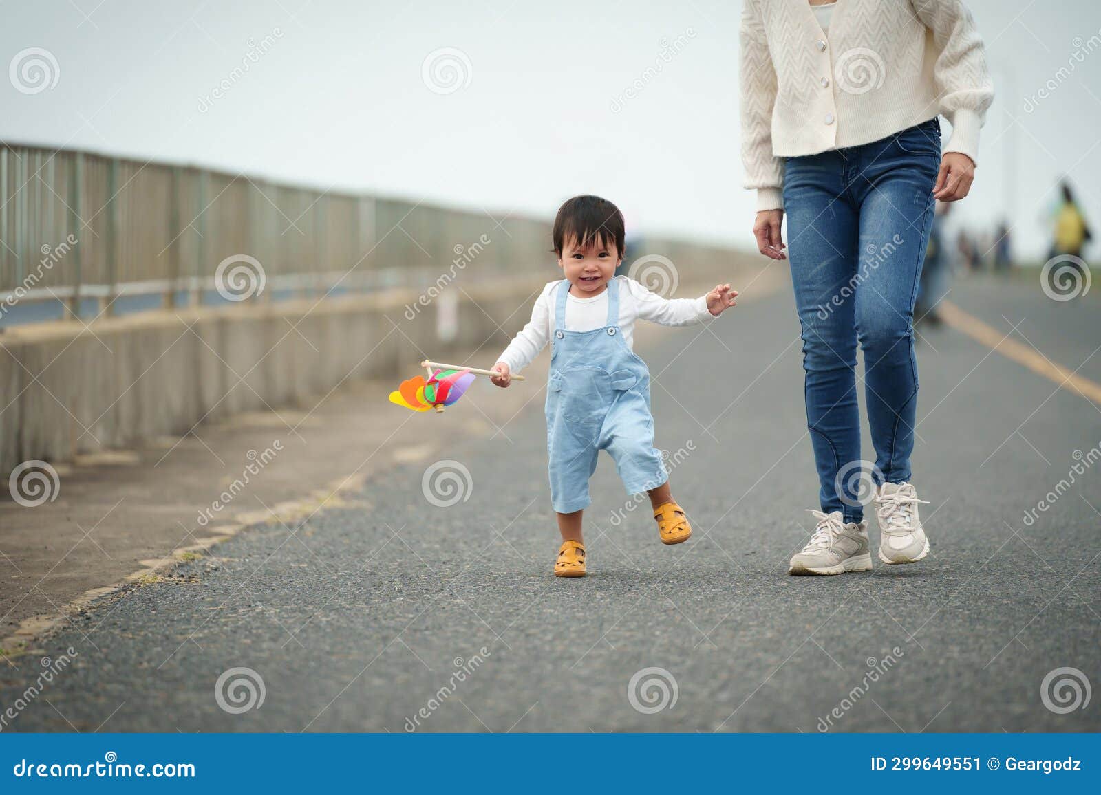 Infant Baby Learn Walking First Step on Pathway with Mother Helping ...