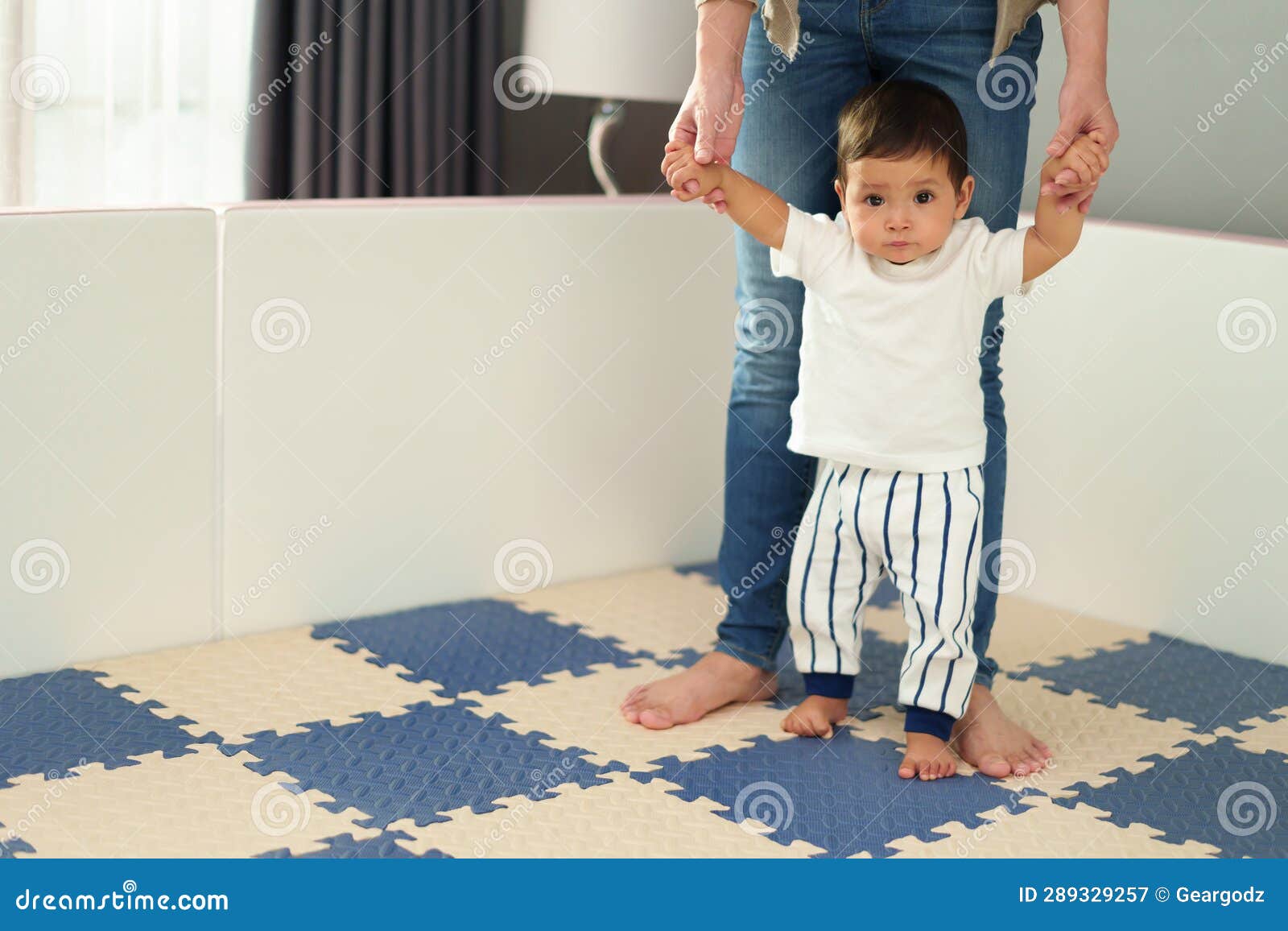 Infant Baby Learning To Standing with Mother on Floor Stock Image ...