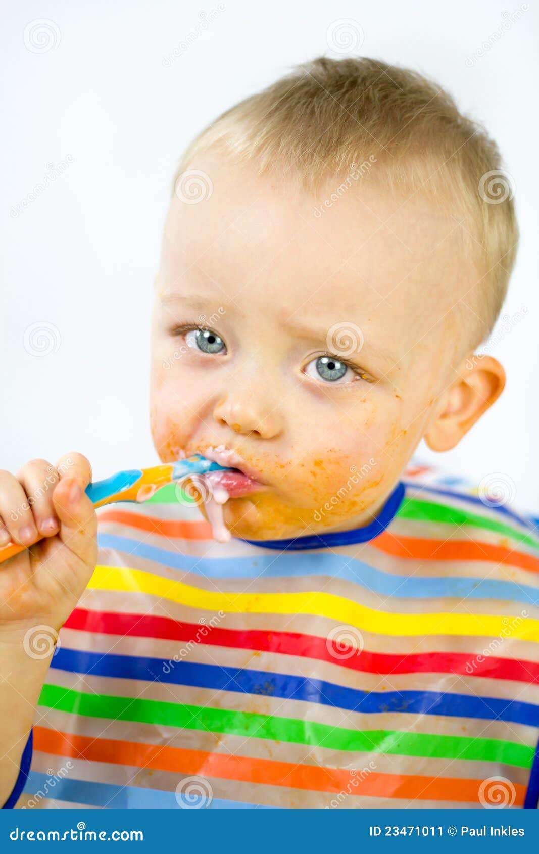 Infant Eating with Food Round His Face Stock Image - Image of plain ...