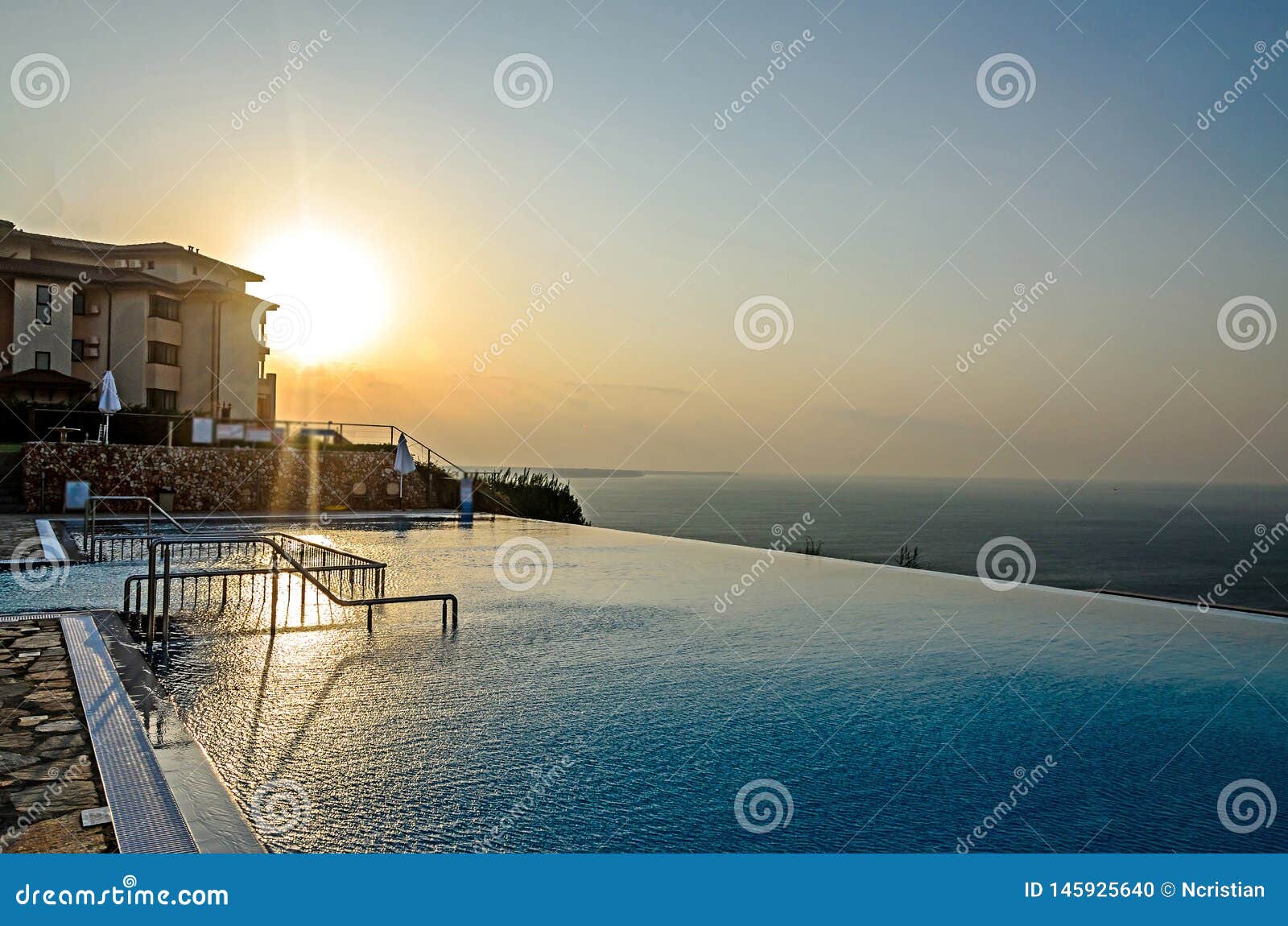 Infinity Pool with Crystal Blue Water View To Sea Ocean Stock Photo ...