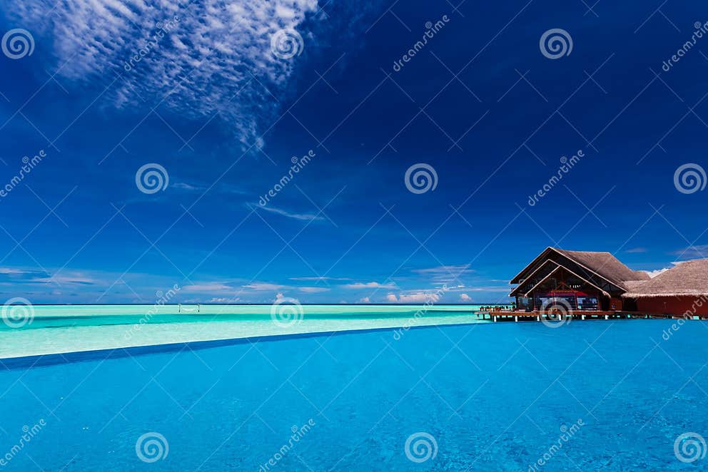 Infinity Pool Over Tropical Lagoon with Blue Sky Stock Image - Image of ...