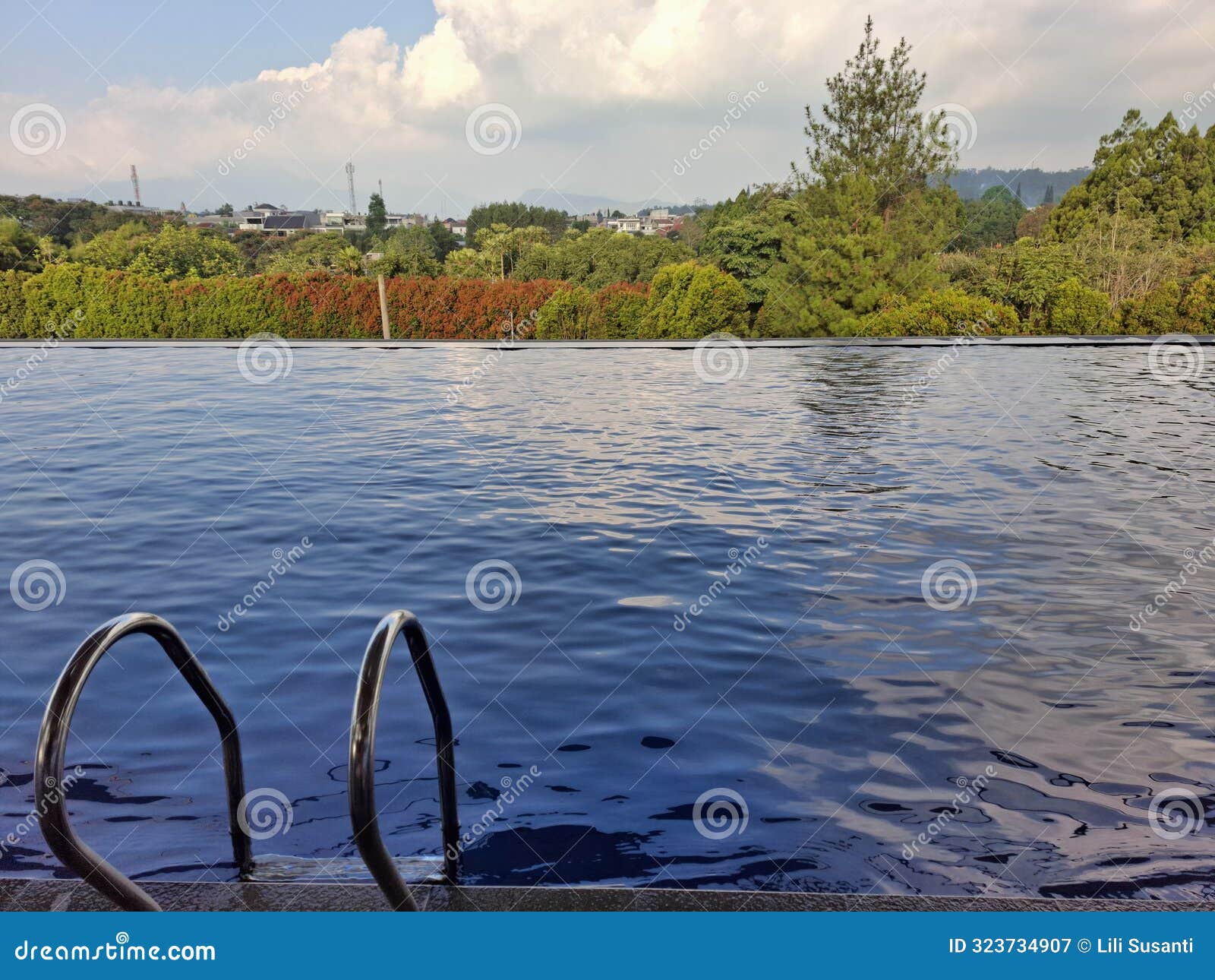 Infinity swimming pool stock image. Image of morning - 323734907
