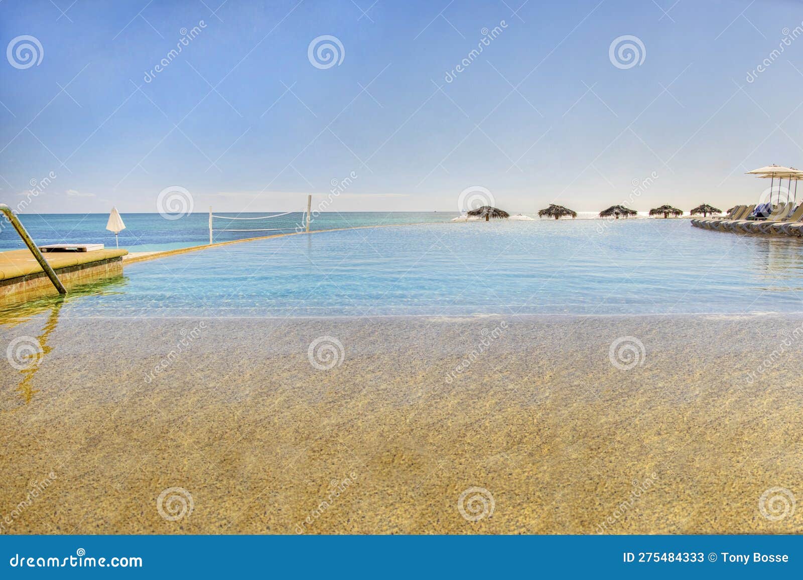 Infinity Pool on the Beach stock image. Image of vacation - 275484333