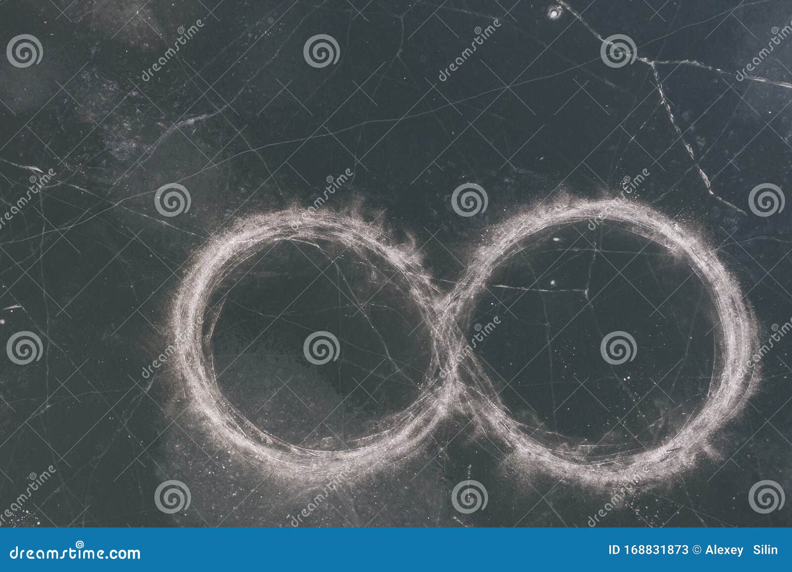 The Infinity Sign is Drawn on the Frozen Surface of the Lake. Stock ...