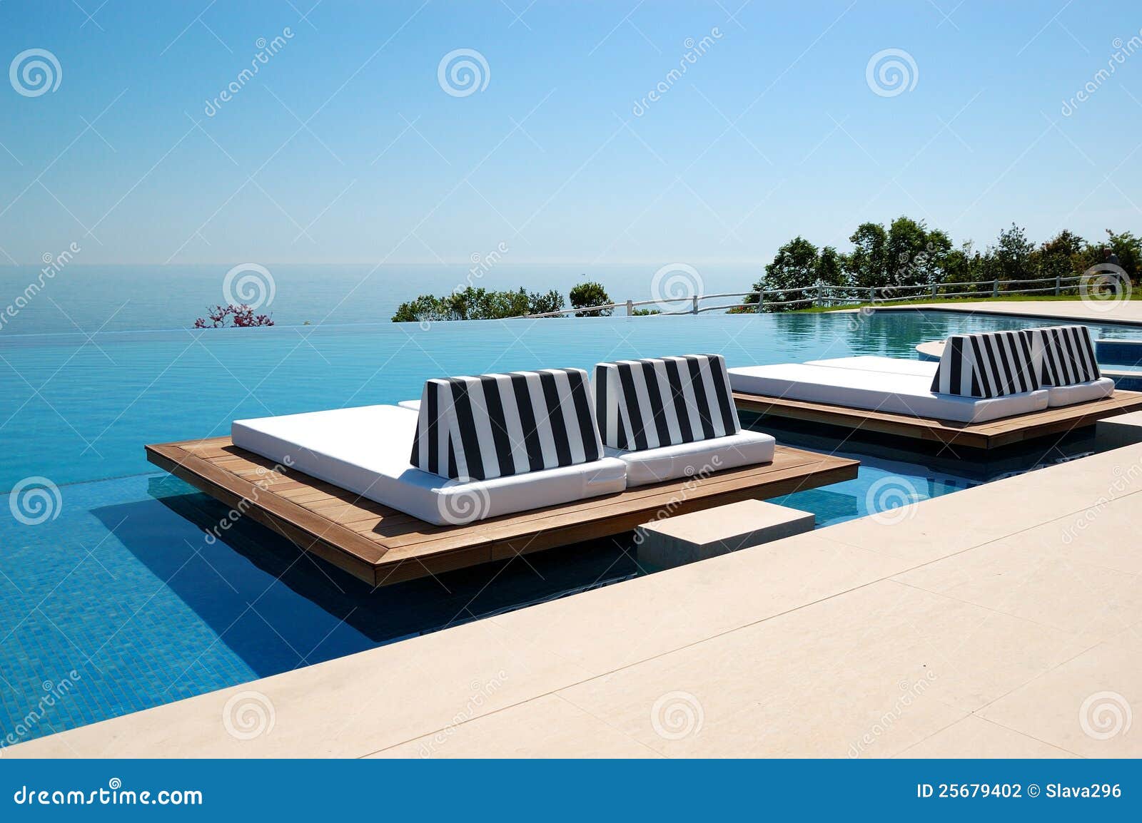 Infinity Swimming Pool by Beach Stock Photo - Image of modern, travel ...