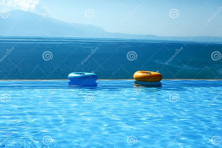 Infinity Swimming Pool with Sea and Mountain View Stock Photo - Image ...