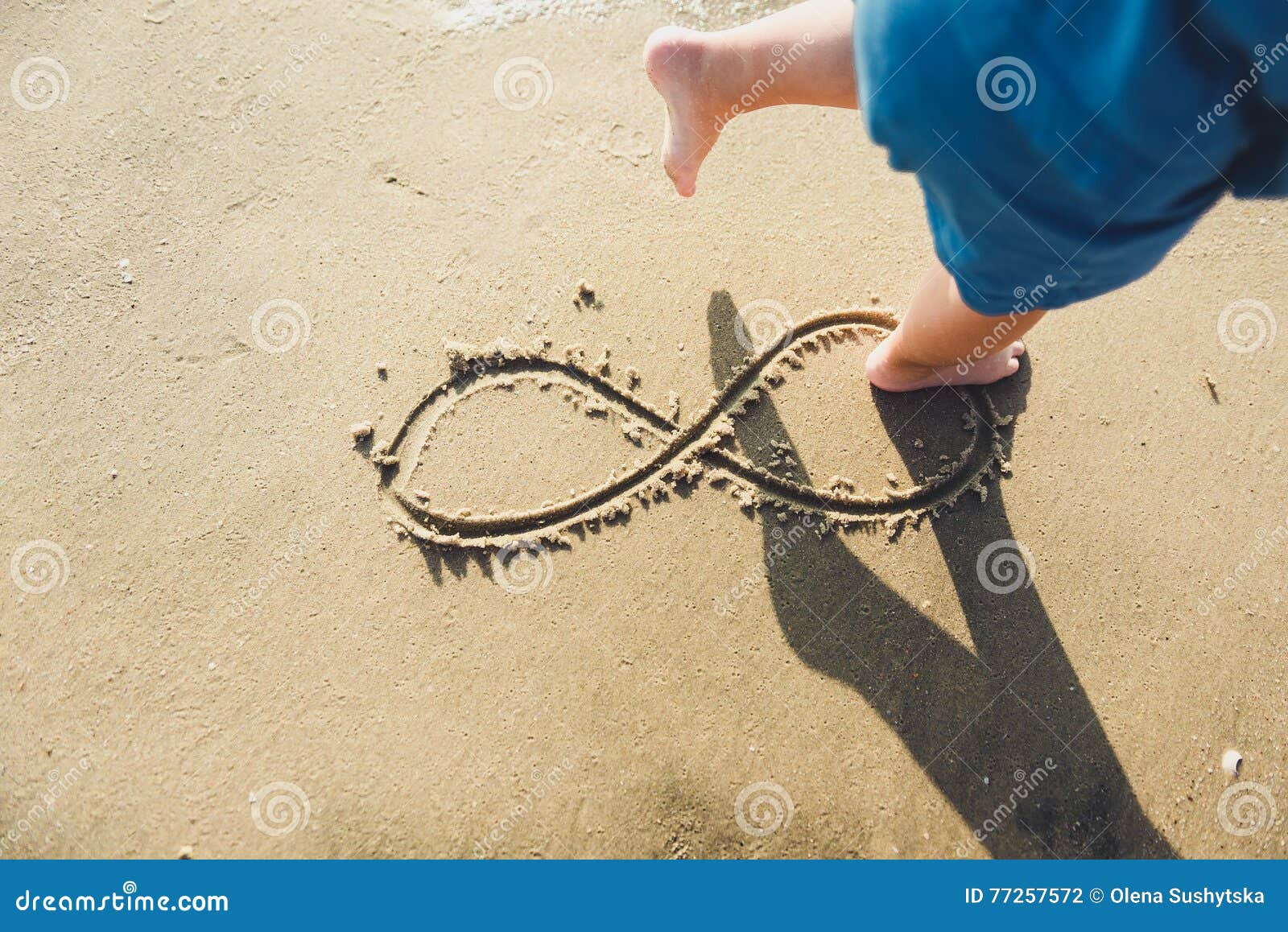 Infinity Symbol Written On Sand. Stock Photo | CartoonDealer.com #77257572