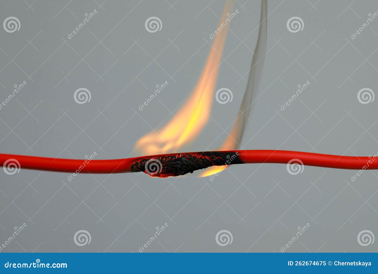 Inflamed Red Wire on Grey Background, Closeup. Electrical Short Circuit ...