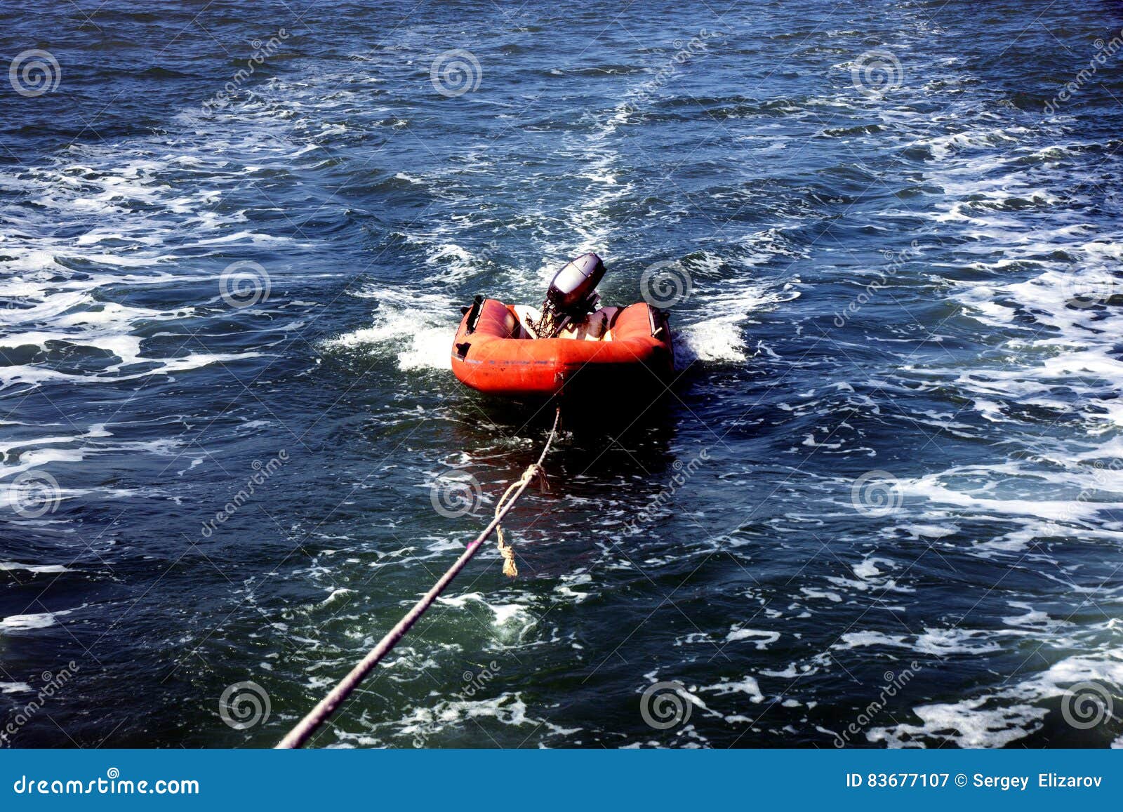 Inflatable Dinghy with Outboard Motor at the Wire Stock Image - Image ...