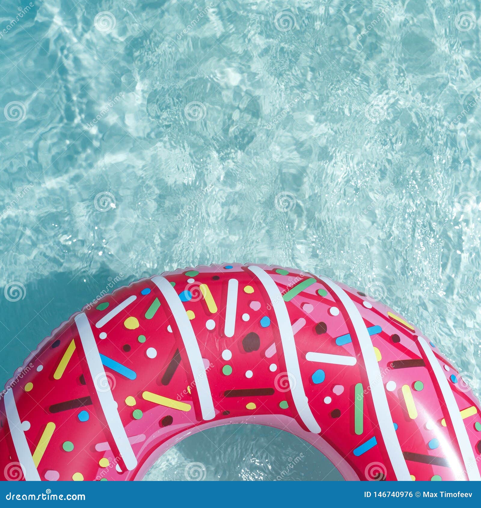 Inflatable Float Rubber Ring in the Form of a Pink Donut in the Blue ...