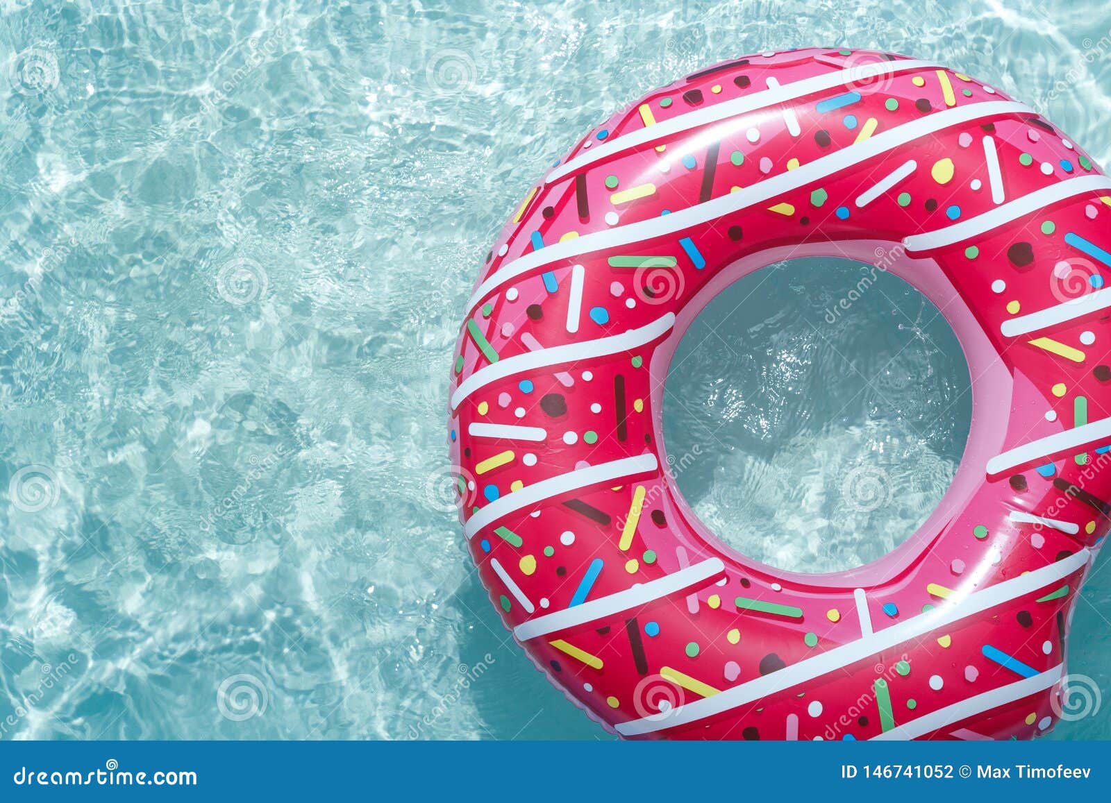 Inflatable Float Rubber Ring in the Form of a Pink Donut in the Blue ...