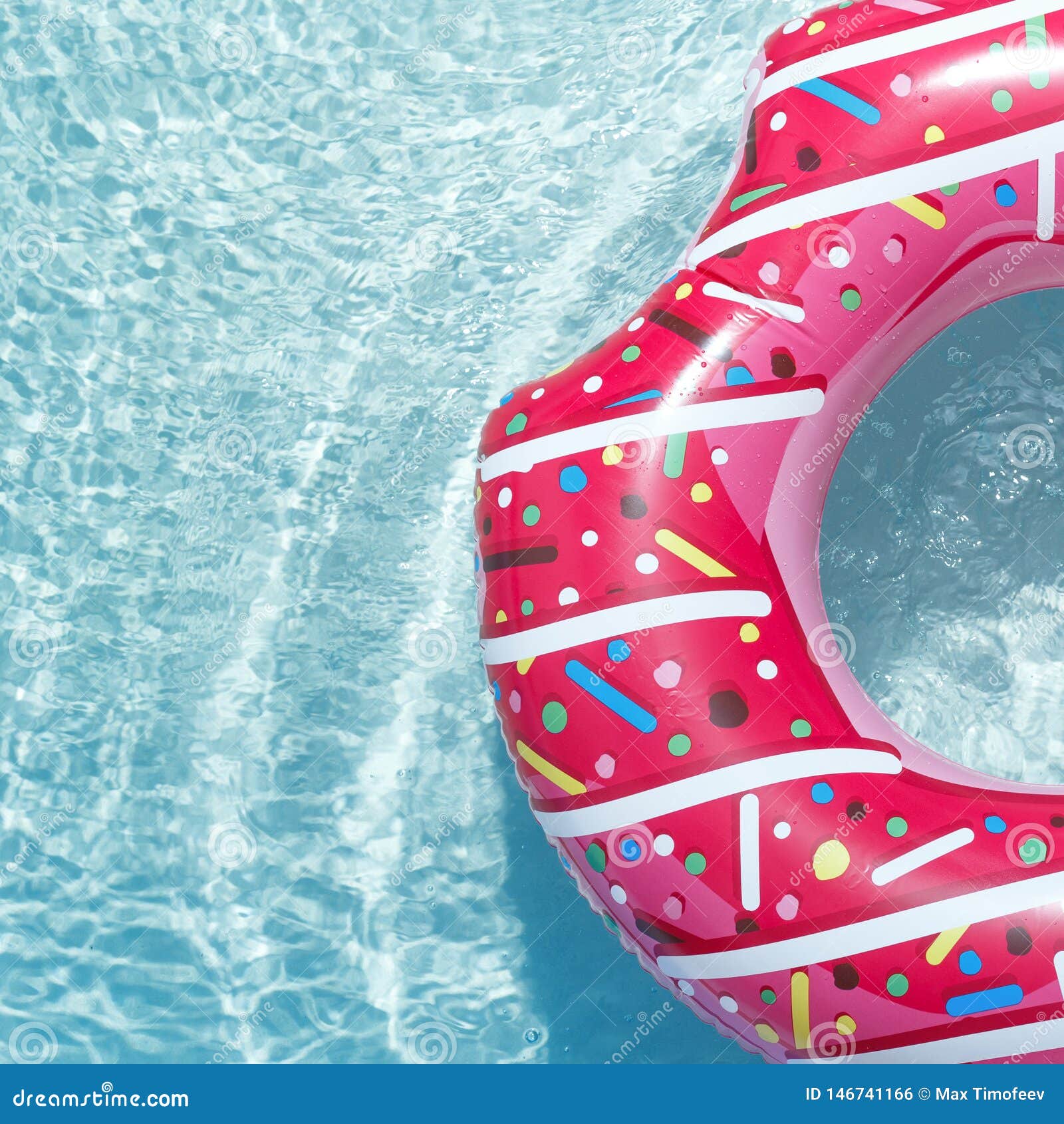 Inflatable Float Rubber Ring in the Form of a Pink Donut in the Blue ...