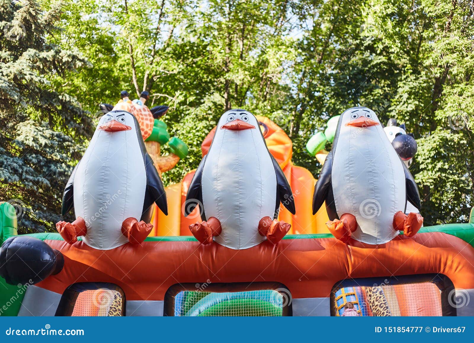 Inflatable Penguins from a Cartoon on a Children`s Attraction Stock ...