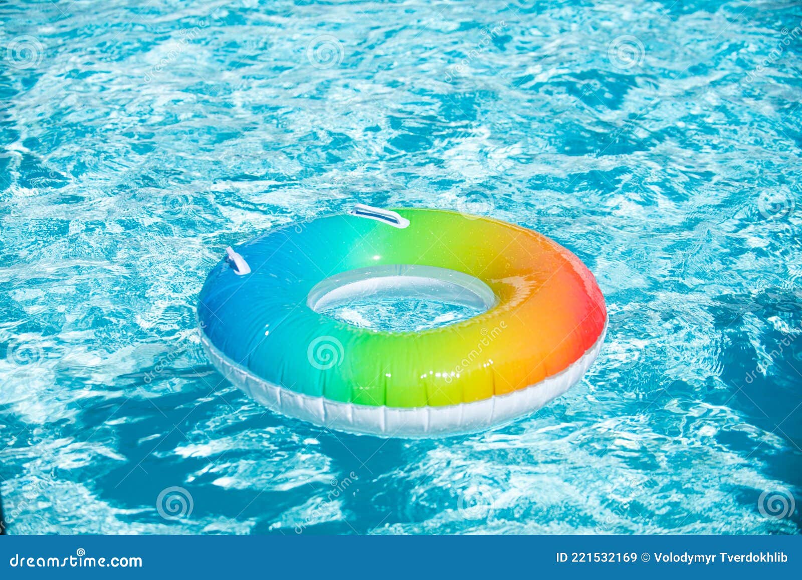 Inflatable Ring Floating in Pool on Summer Background. Rainbow Swimming ...