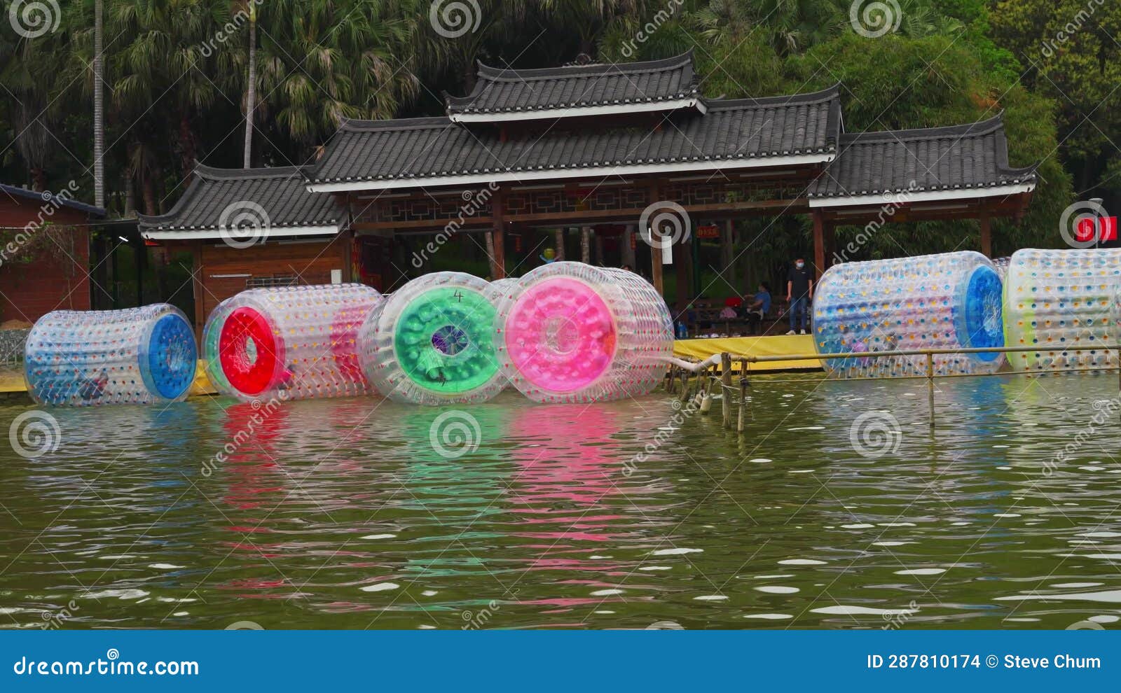 Inflatable Roller Game in Water Playground Stock Footage - Video of ...