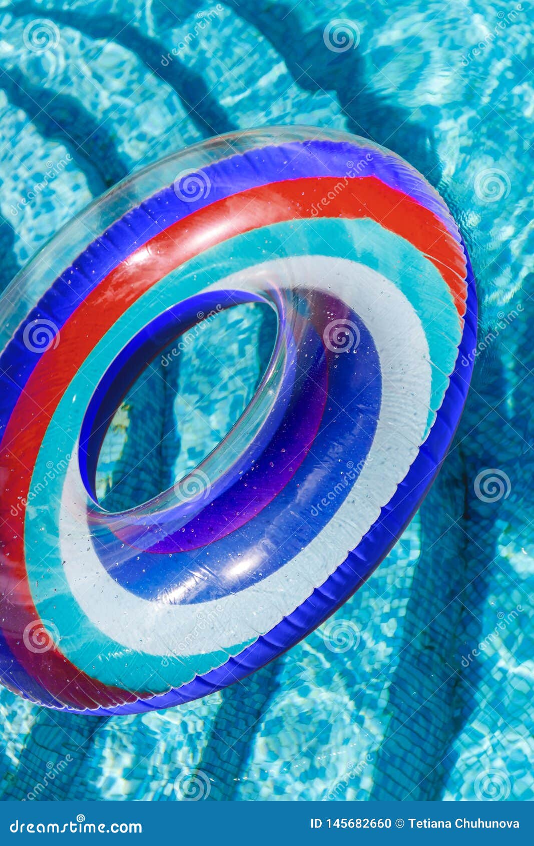 Inflatable Water Activities Circles Tuba Float on the Water in the Pool ...