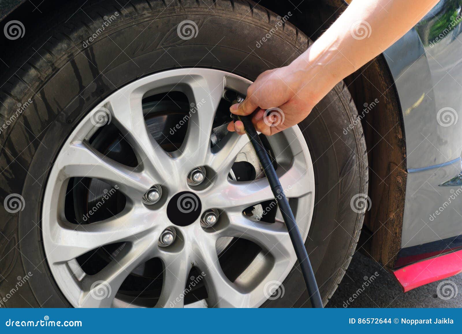 Inflating the Automobile Wheels Via a Pump Stock Photo - Image of ...