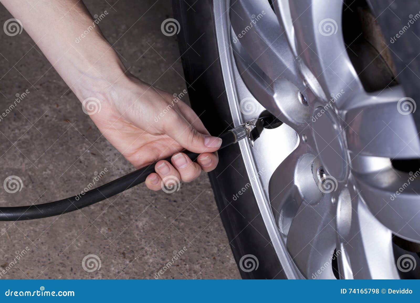 Inflating the wheels stock photo. Image of compressor - 74165798