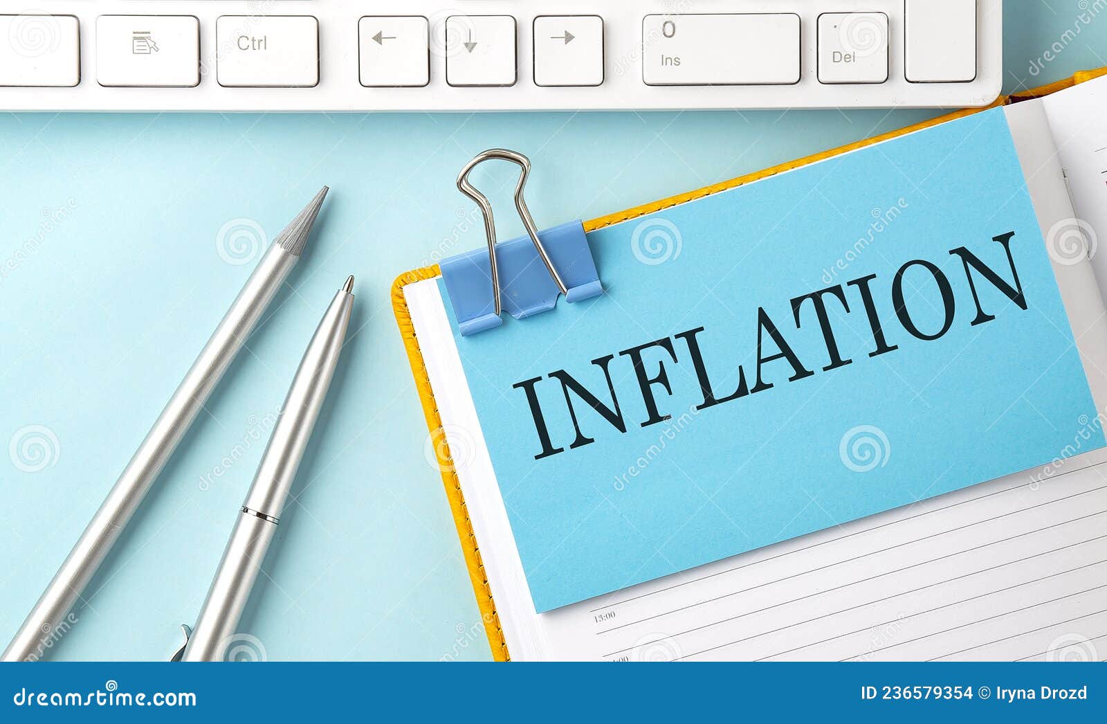 INFLATION Text on Sticker on the Blue Background with Pen and Keyboard ...