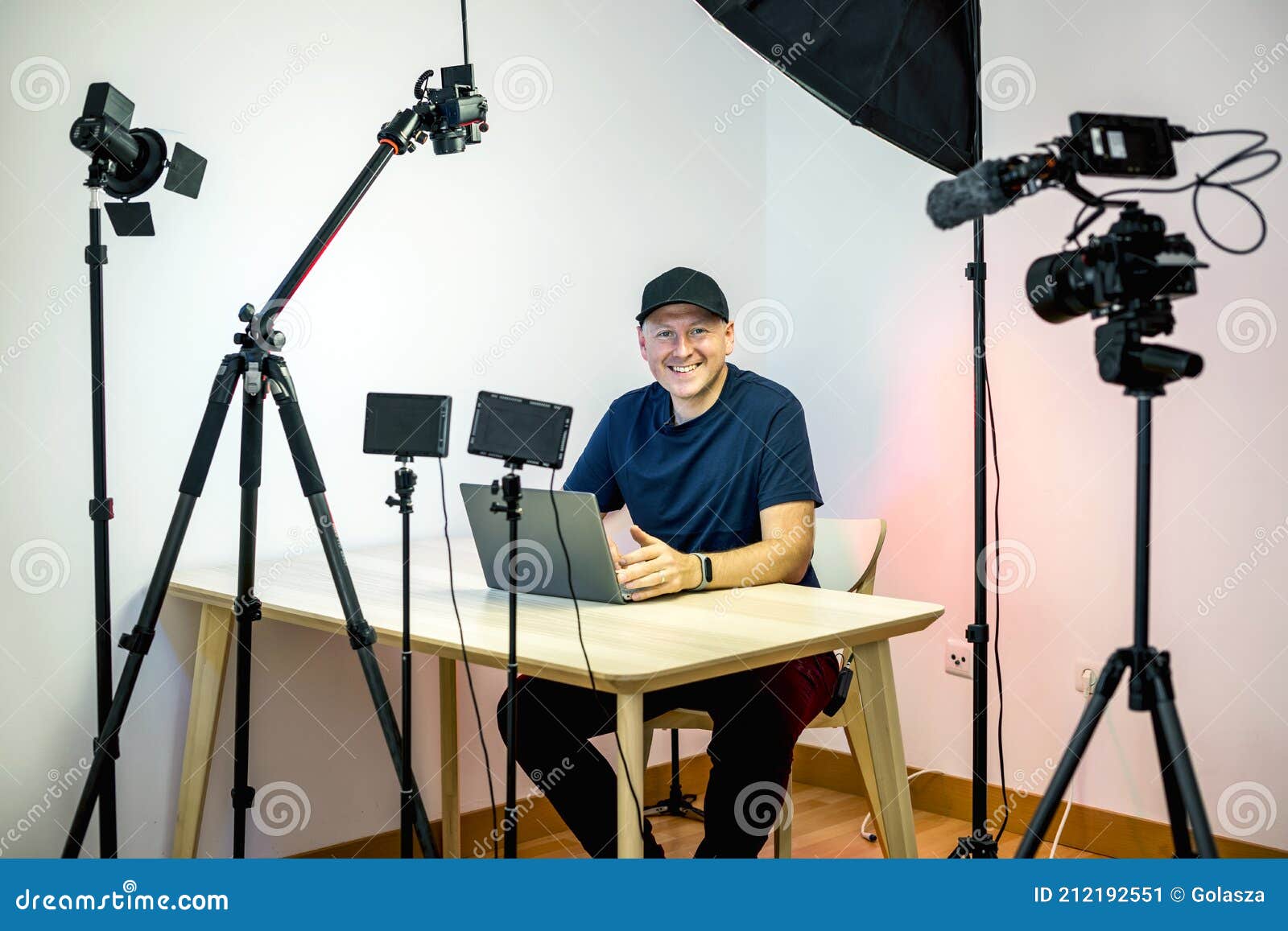 An Influencer with a Laptop Creating Content in His Studio Stock Image ...