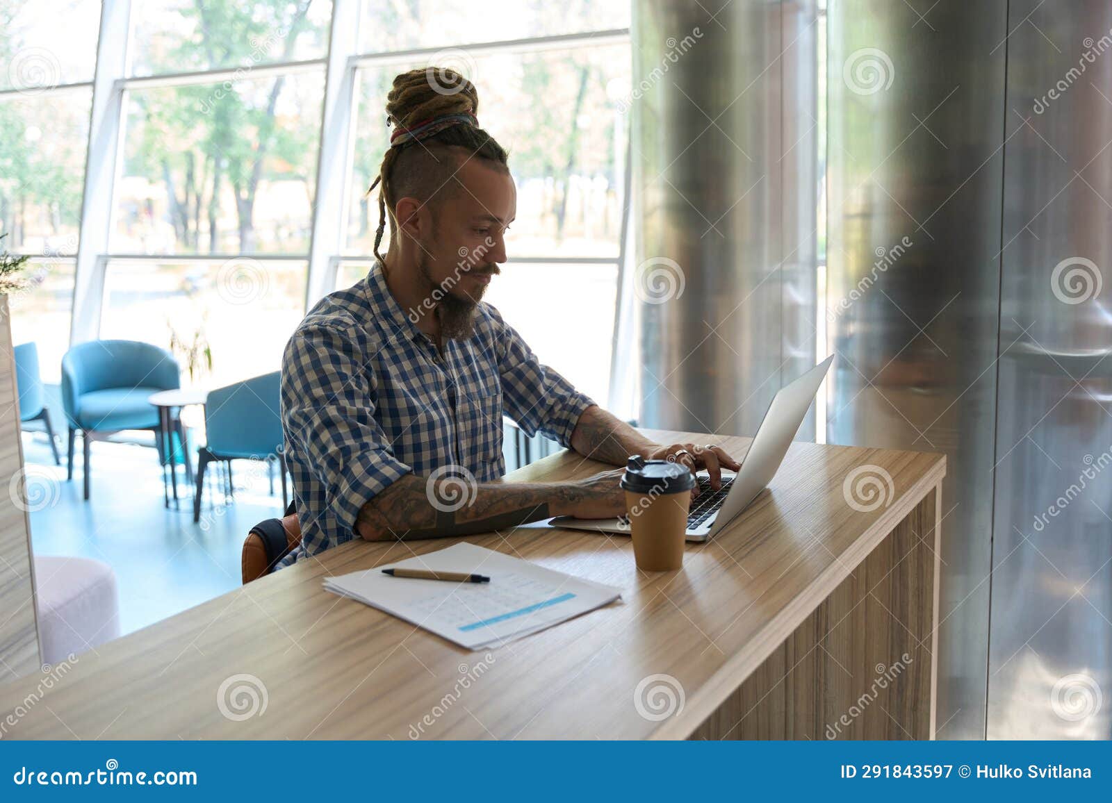 Informal Guy Works on a Laptop at a Large Table Stock Image - Image of ...
