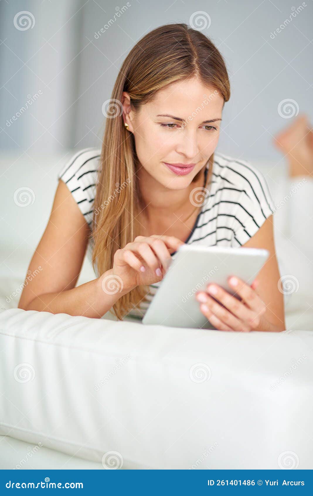 Information at Her Fingertips. a Young Woman Browsing the Internet at ...