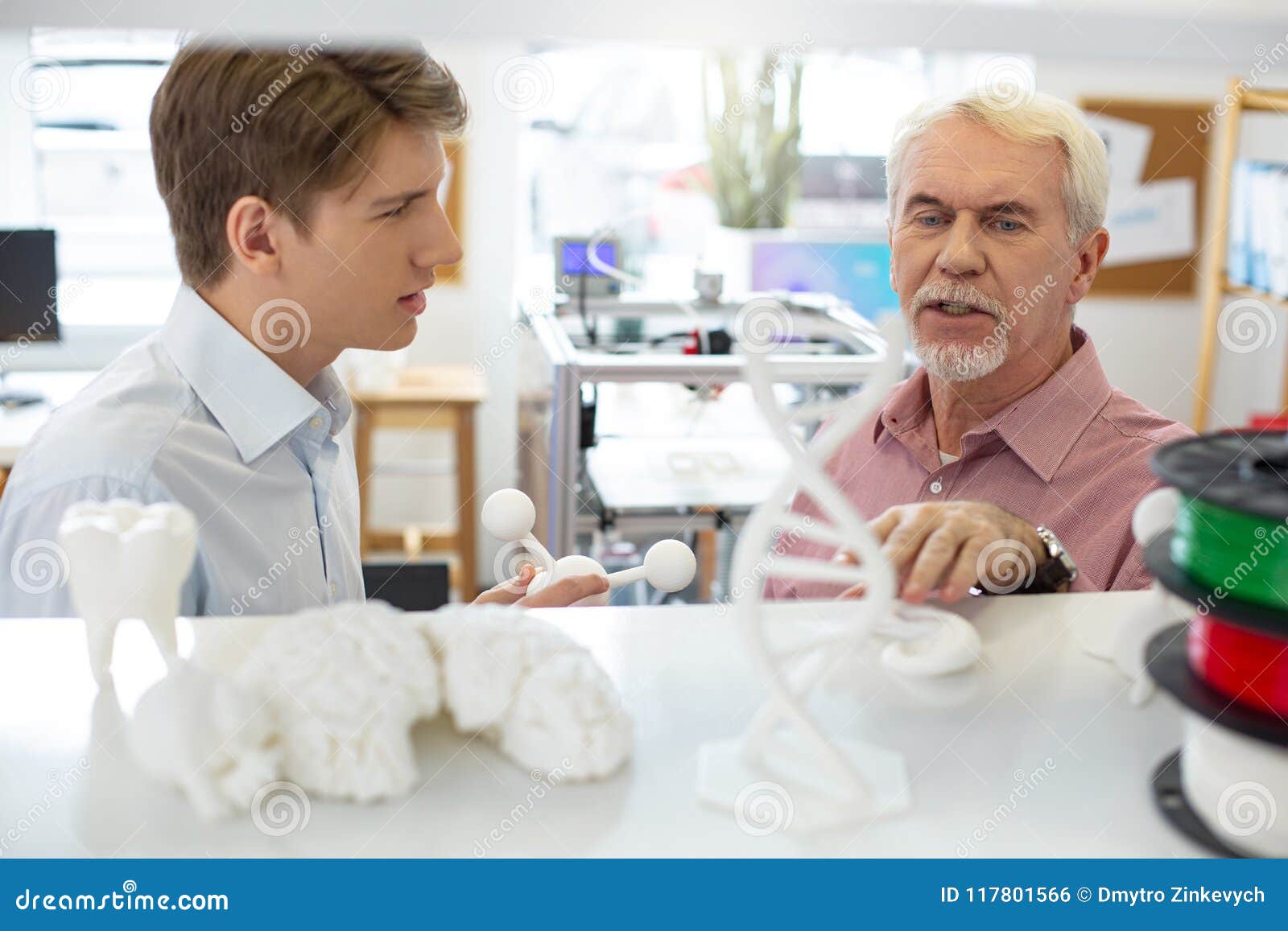 Young Man and His Supervisor Discussing 3D Models Stock Photo - Image ...