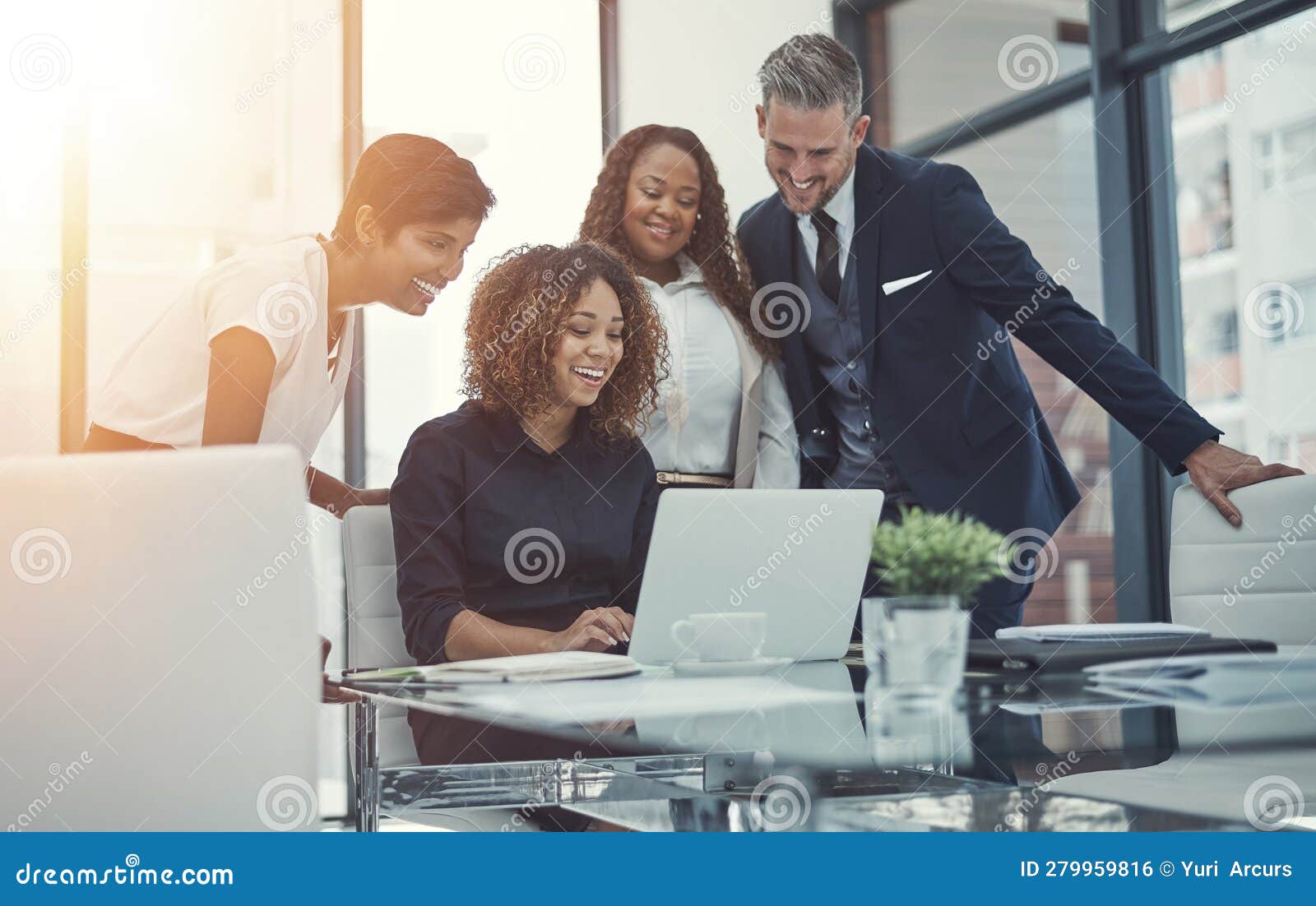 An Informed Team is a Successful Team. a Group of Colleagues Using a ...