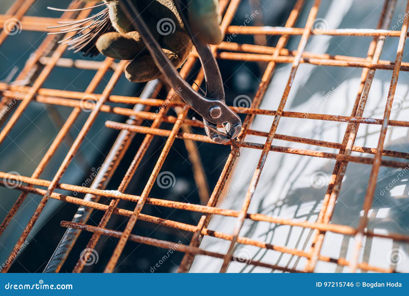 Infrastructure - Construction Worker Hands Securing Steel Bars with ...