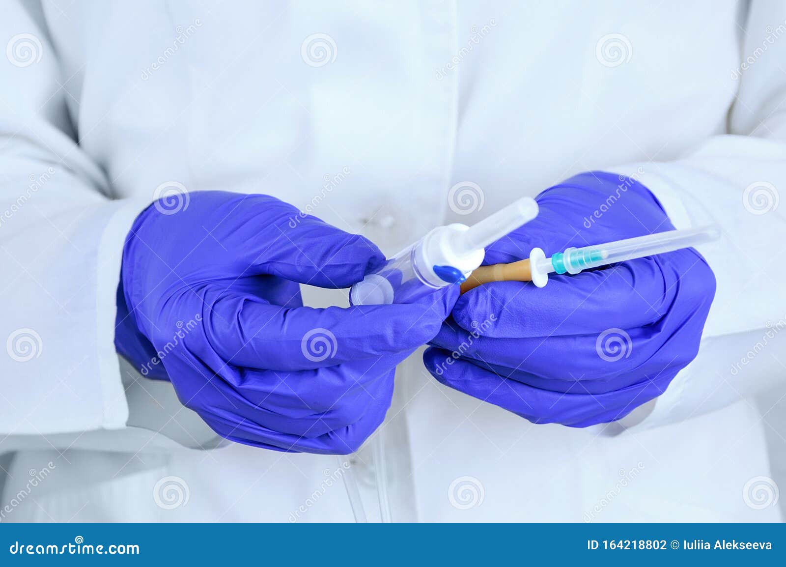 Infusion System with a Needle in the Hands of a Nurse. Stock Photo ...