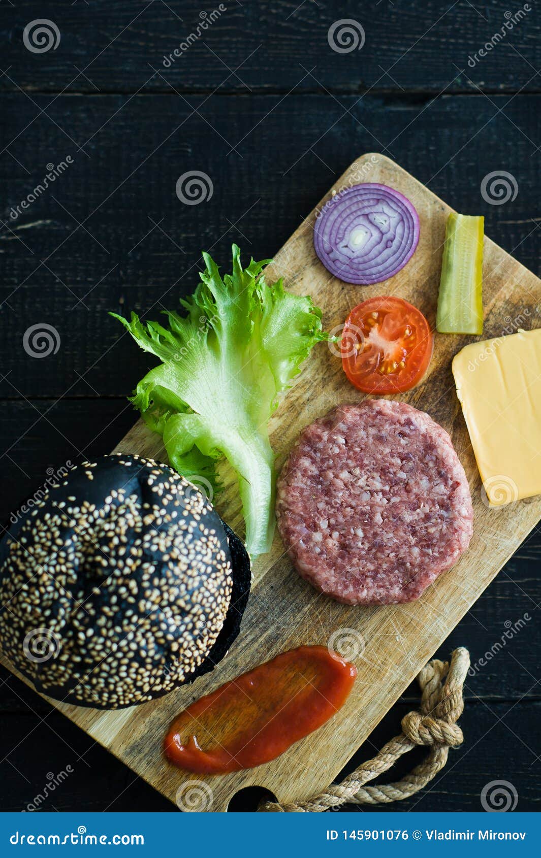 Ingredients for Black Burger on Wooden Chopping Board, Black Background ...