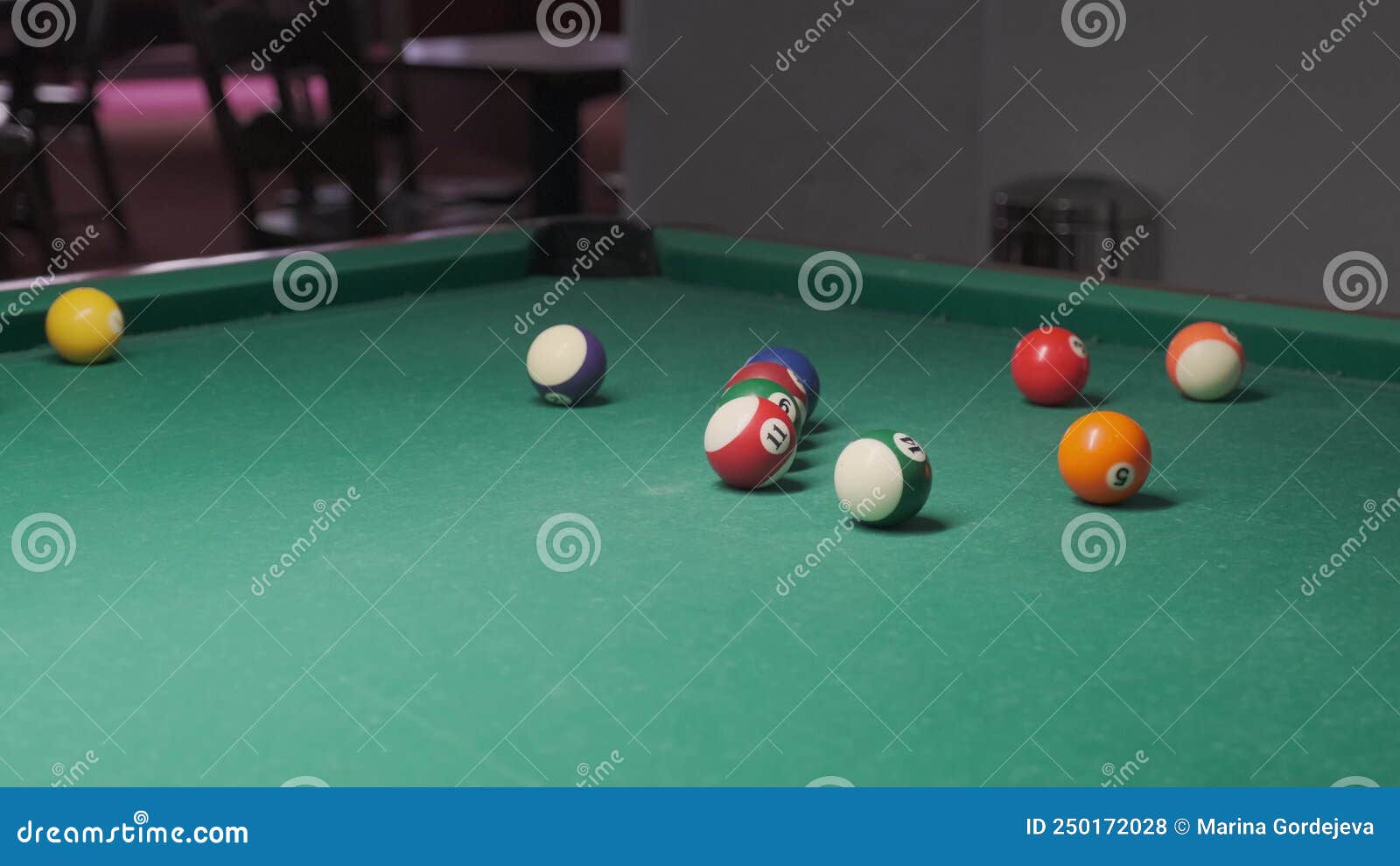 An Initial Strike in a Pool Game on a Green Pool Table Cloth. Snooker ...