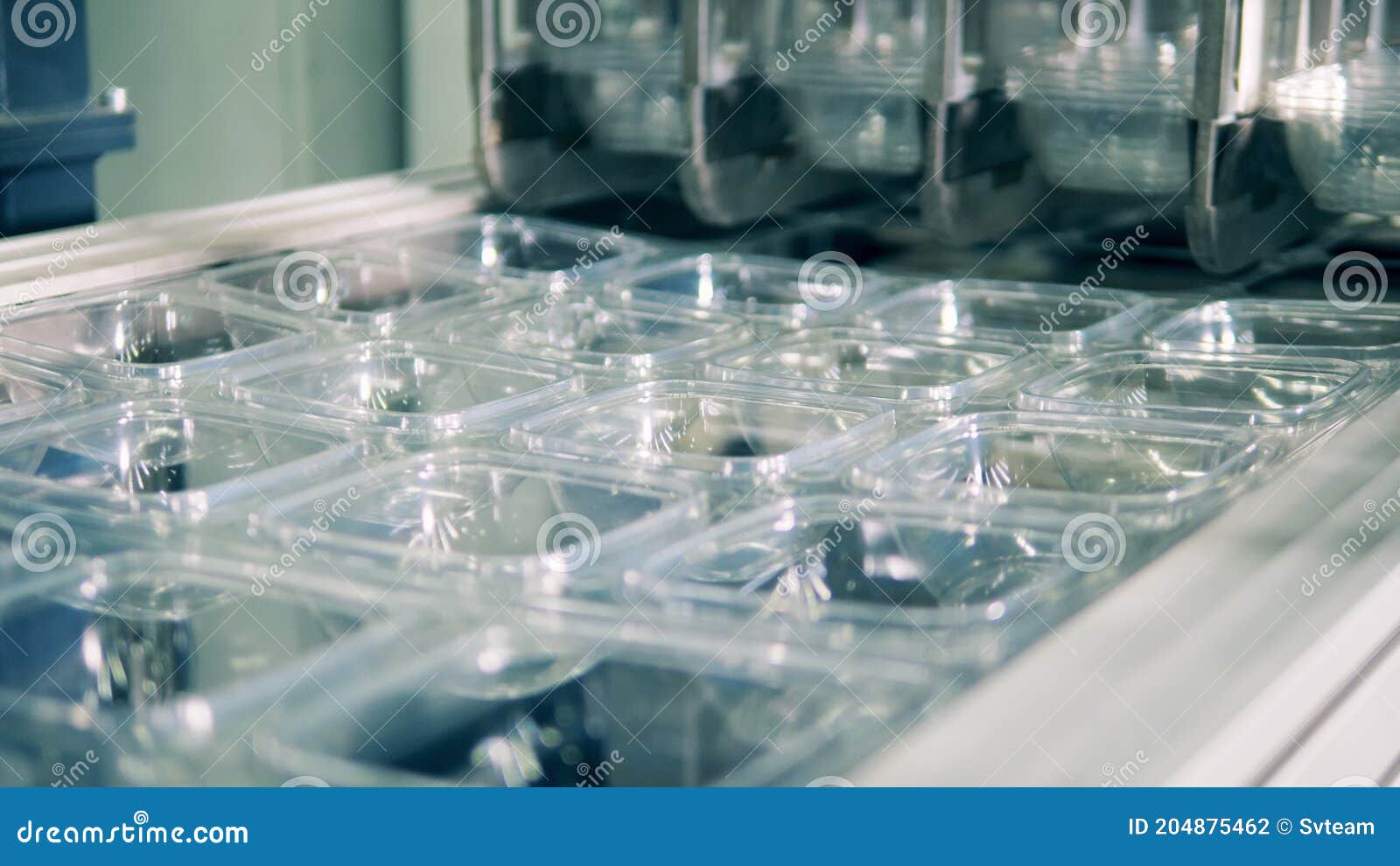 Injection Moulded Plastic Trays are Being Stacked. Top View Stock ...