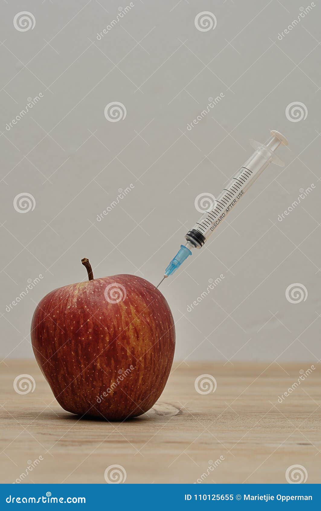 An Injection Needle Stuck into an Apple Stock Image - Image of apple ...